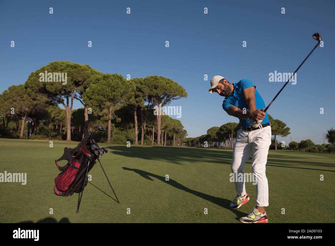 golf player hitting shot Stock Photo - Alamy