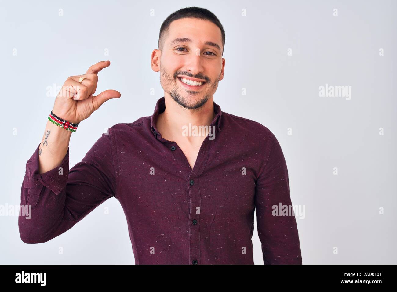 Young handsome business man standing over isolated background smiling ...