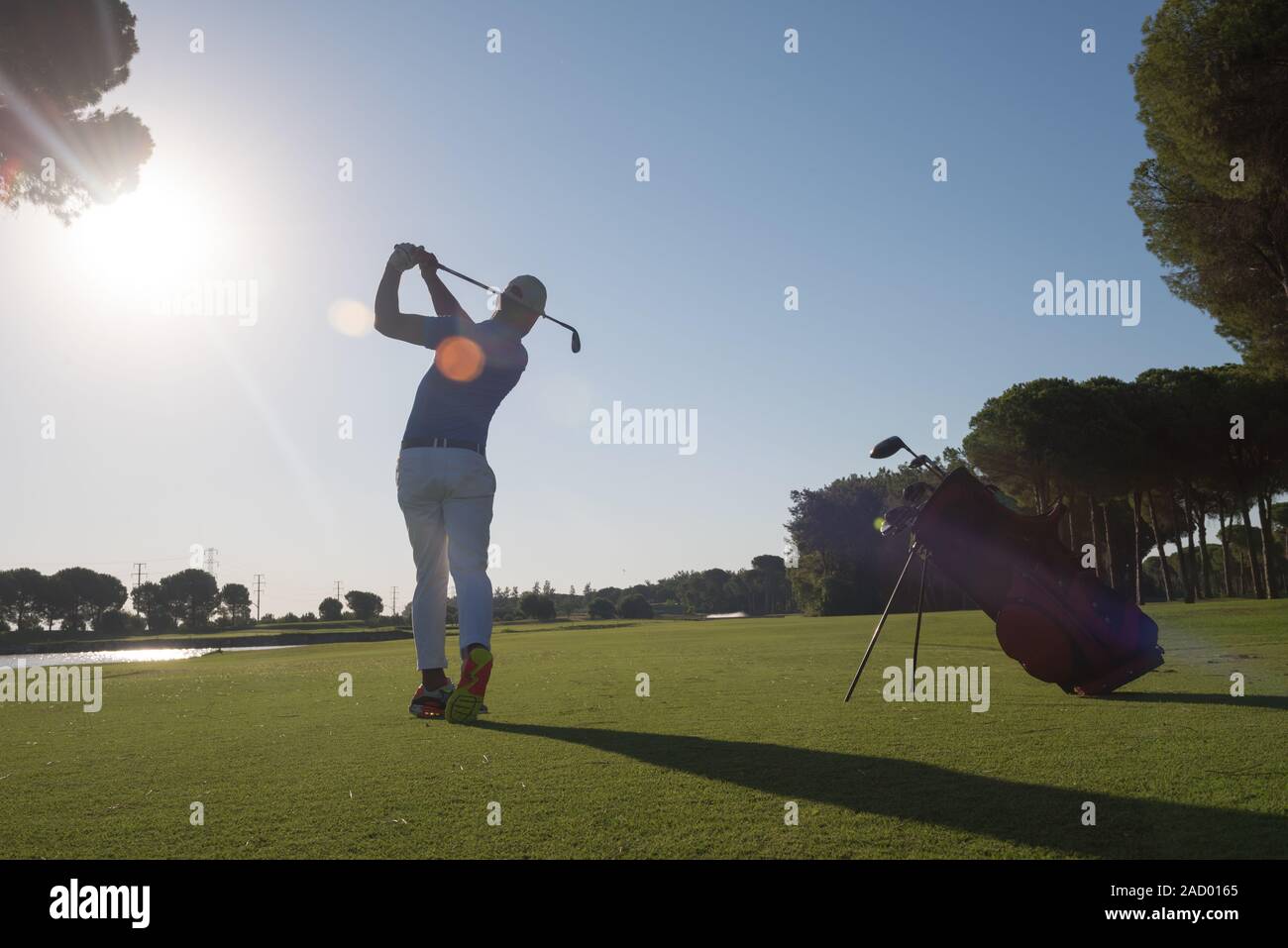 golf player hitting shot Stock Photo - Alamy