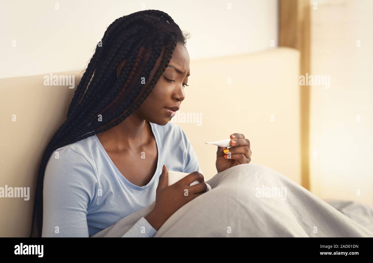 Afro Lady Having Fever Measuring Temperature In Bed At Home Stock Photo ...