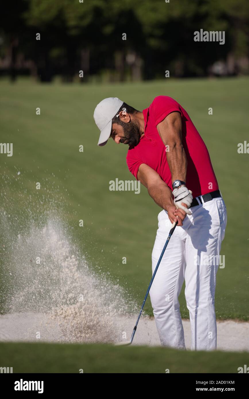 golfer hitting a sand bunker shot Stock Photo - Alamy