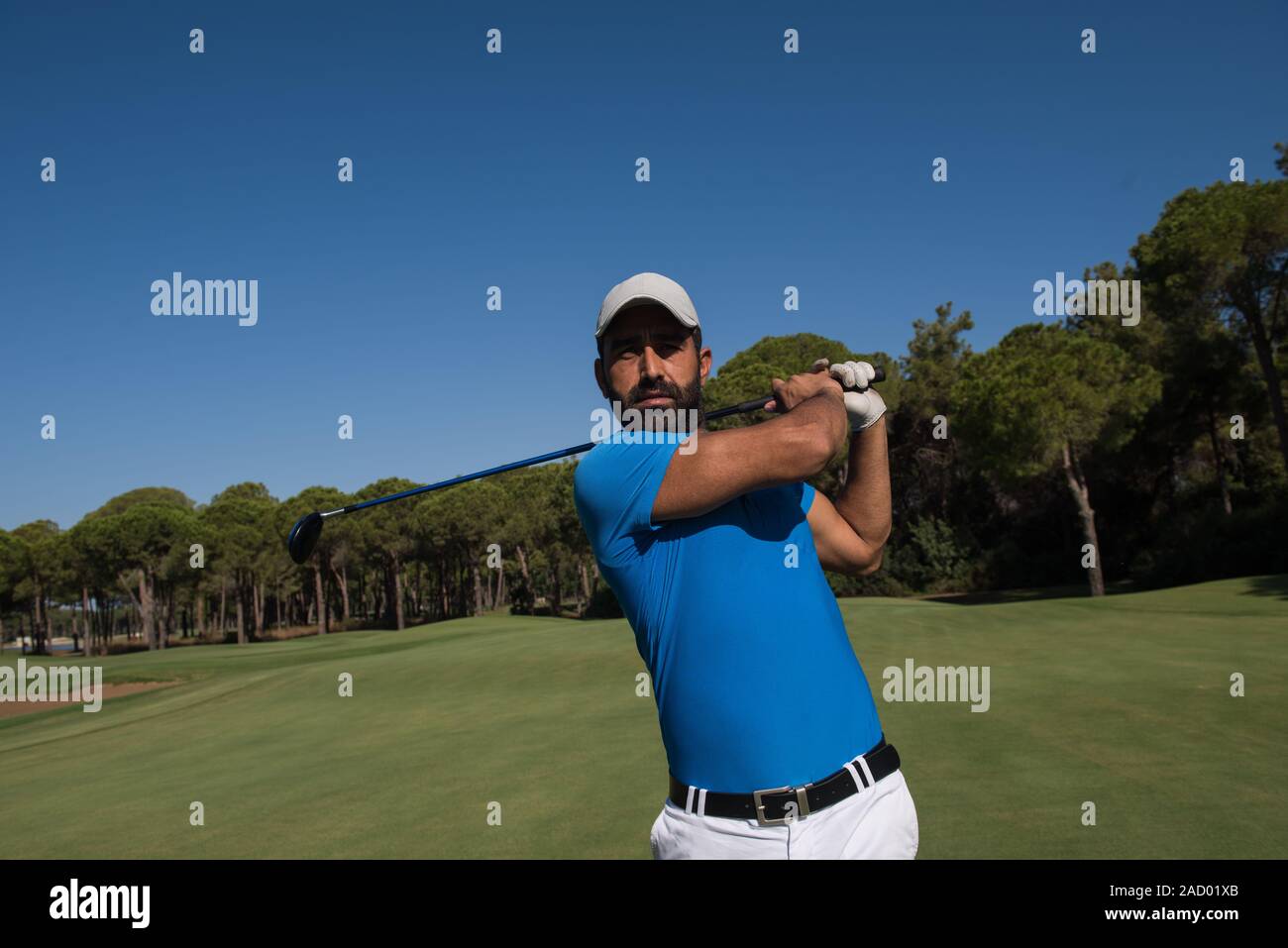 golf player hitting shot Stock Photo - Alamy
