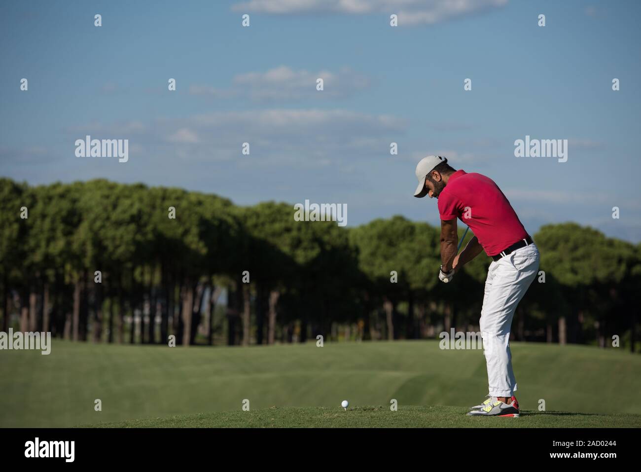 golf player hitting long shot Stock Photo - Alamy