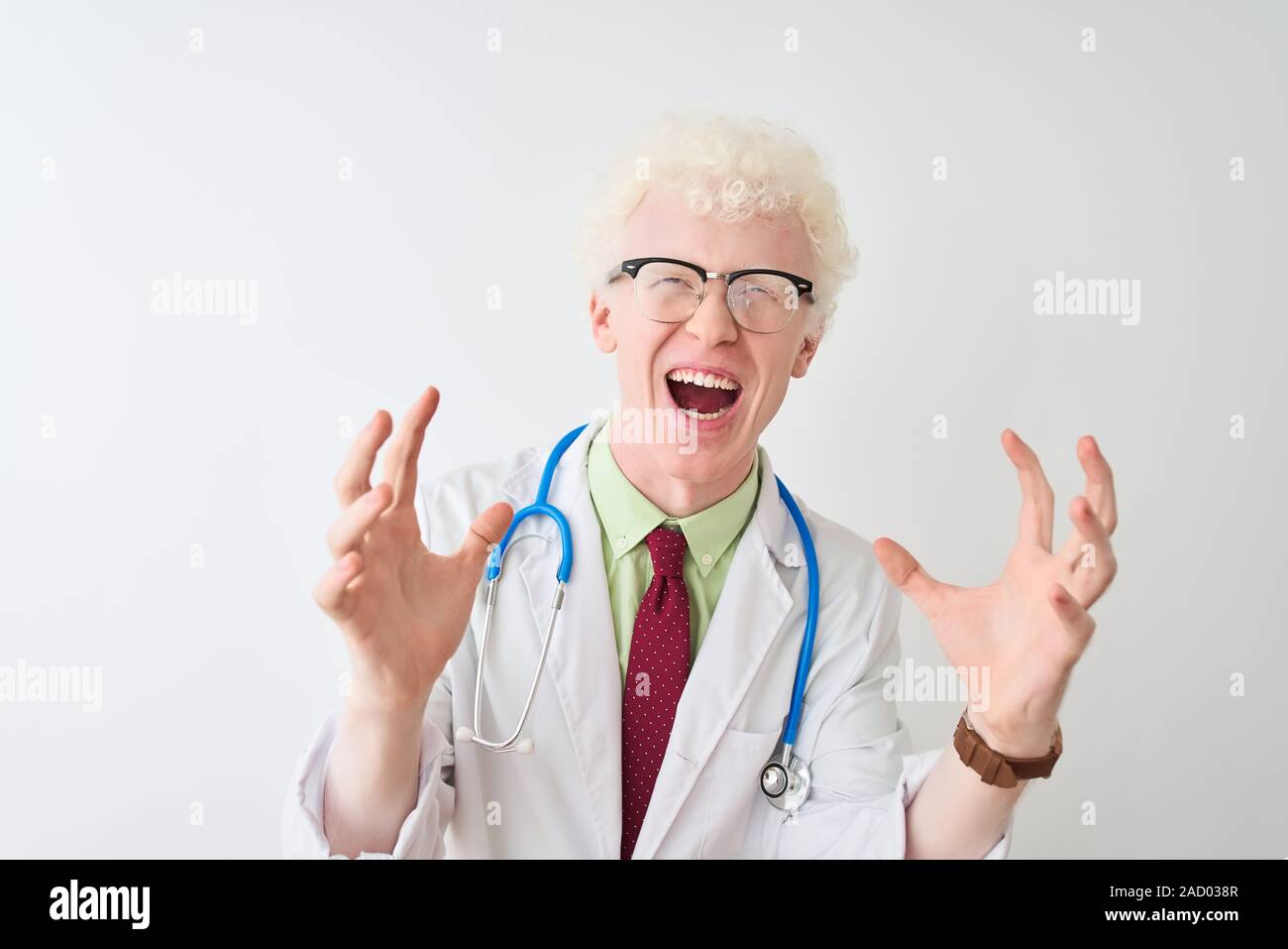 Young albino doctor man wearing stethoscope standing over isolated ...