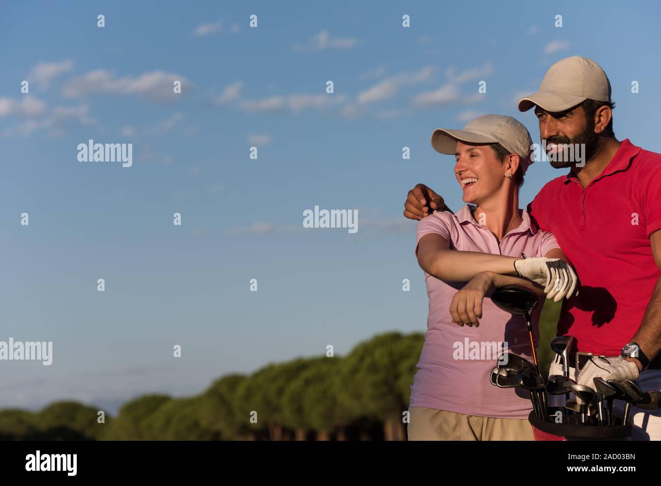 portrait of couple on golf course Stock Photo - Alamy