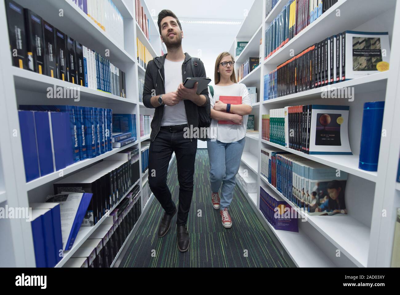 students group in school library Stock Photo - Alamy