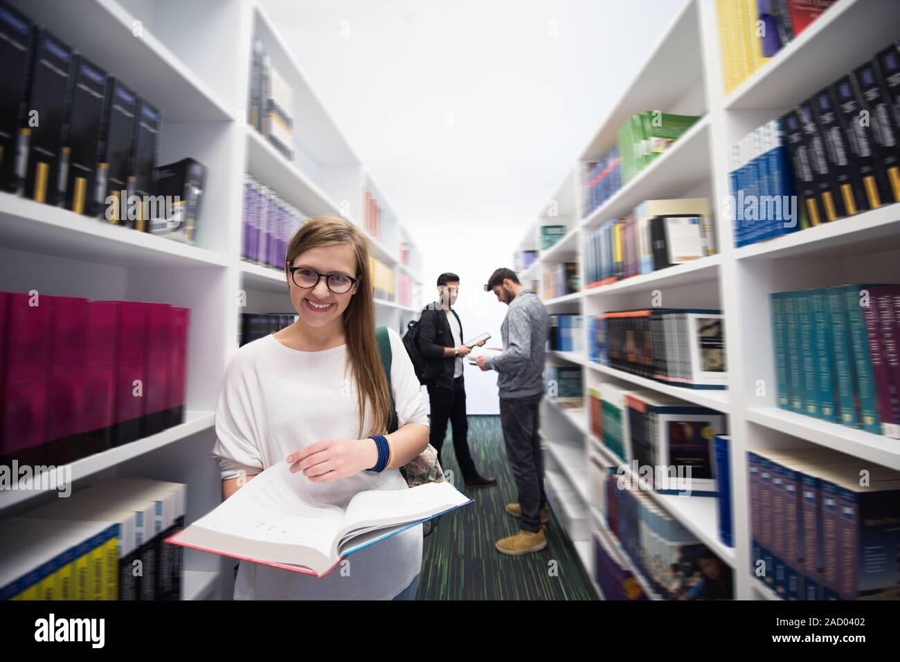 students group in school library Stock Photo - Alamy