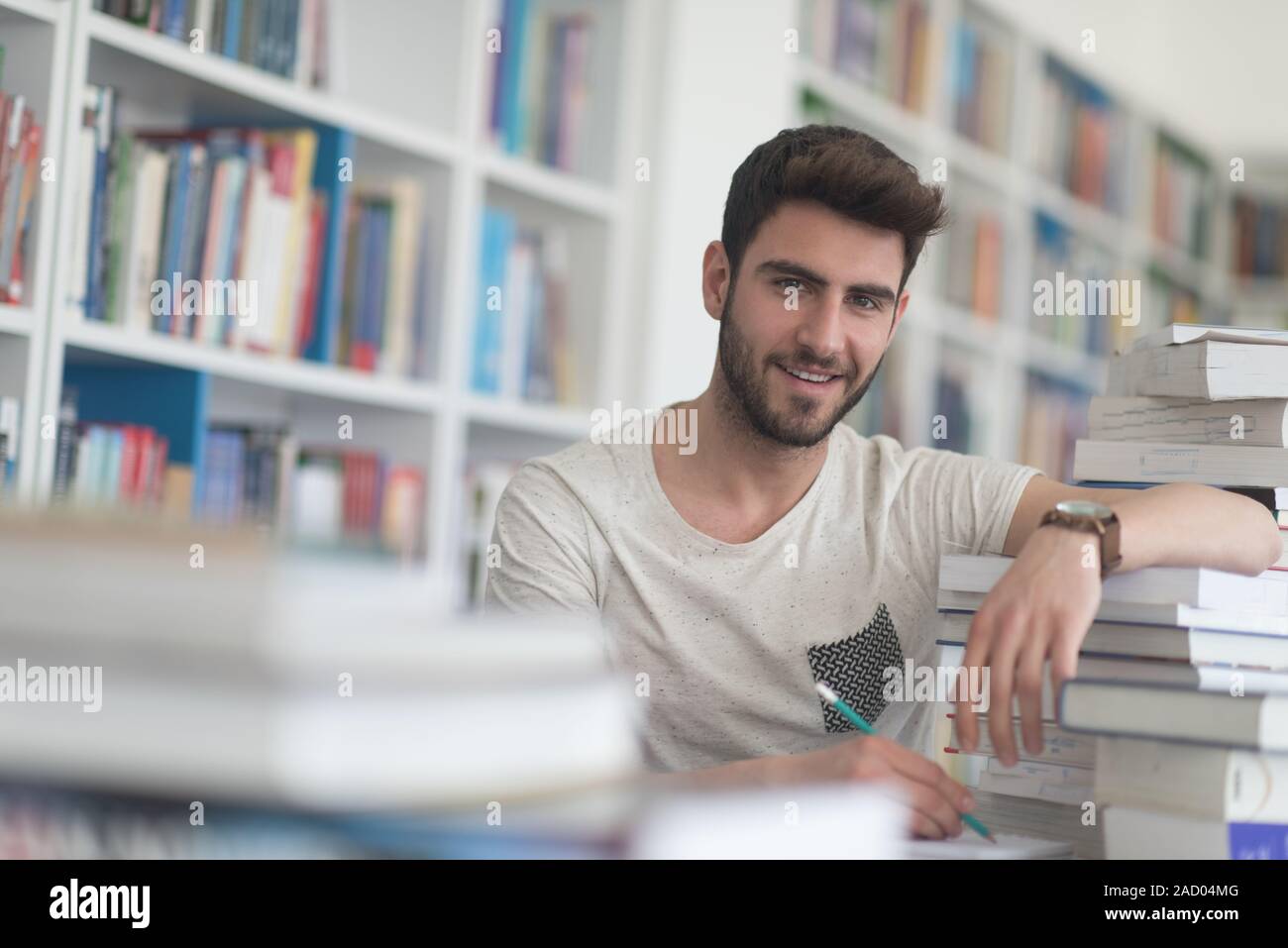 student study in school library Stock Photo - Alamy