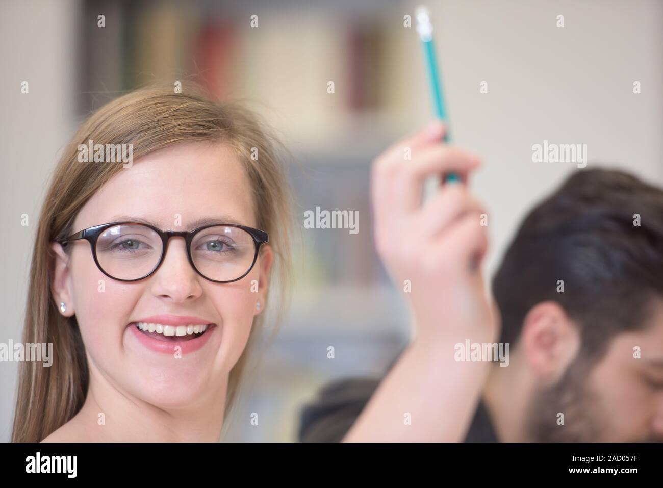 group of students raise hands up Stock Photo - Alamy