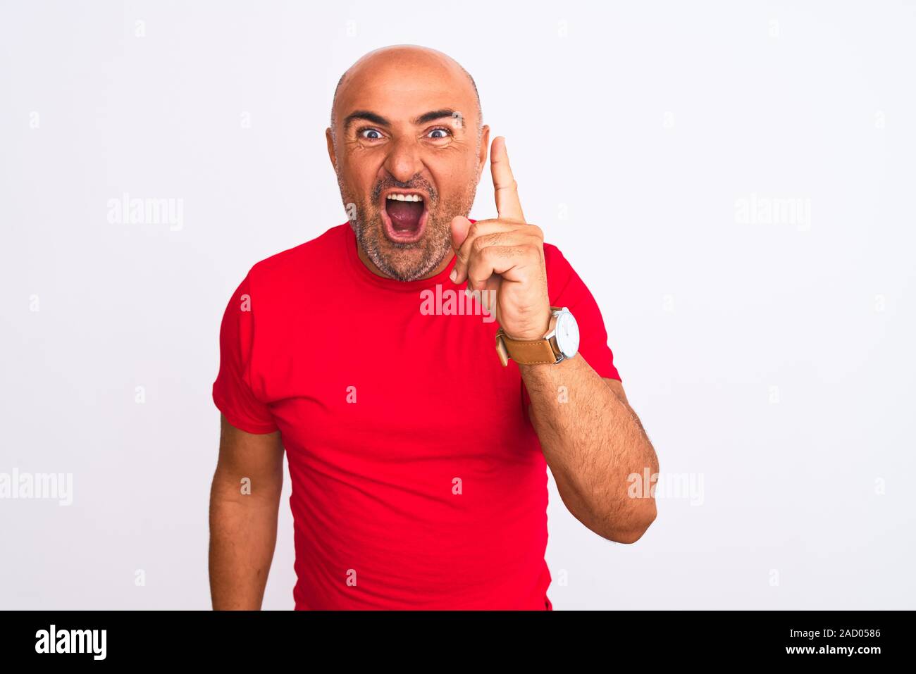 Middle age handsome man wearing red casual t-shirt standing over ...