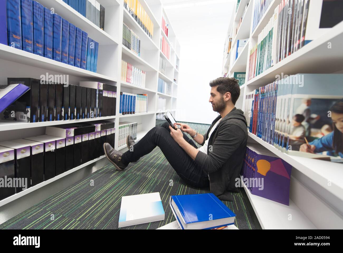 student study in school library Stock Photo - Alamy