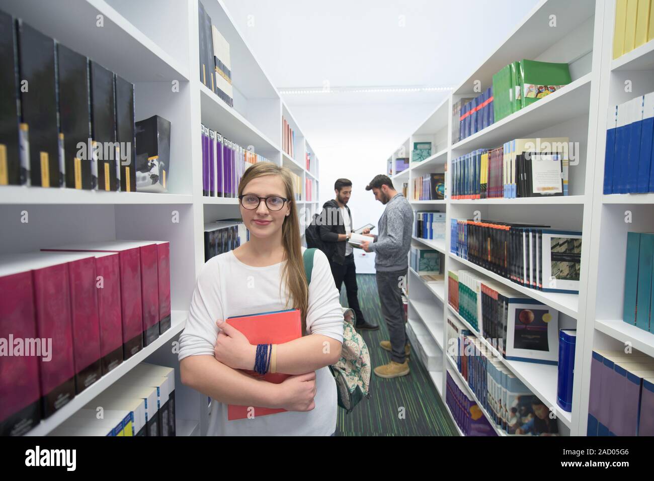 students group in school library Stock Photo - Alamy