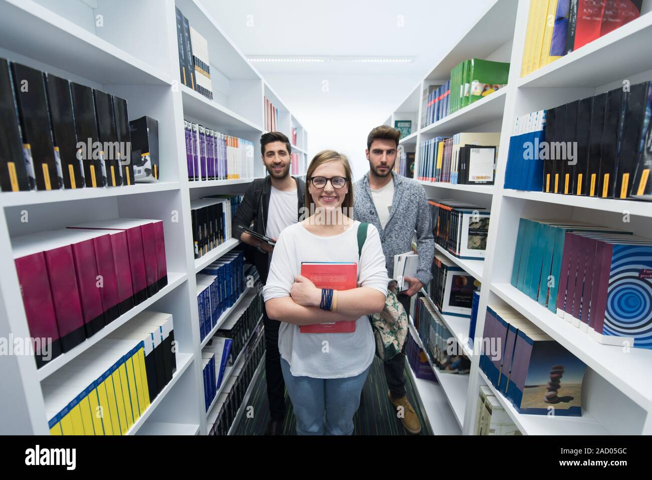 students group in school library Stock Photo - Alamy
