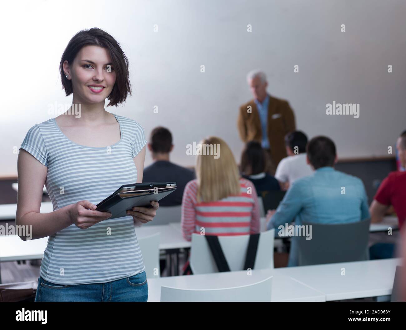 portrait of happy female student in classroom Stock Photo - Alamy