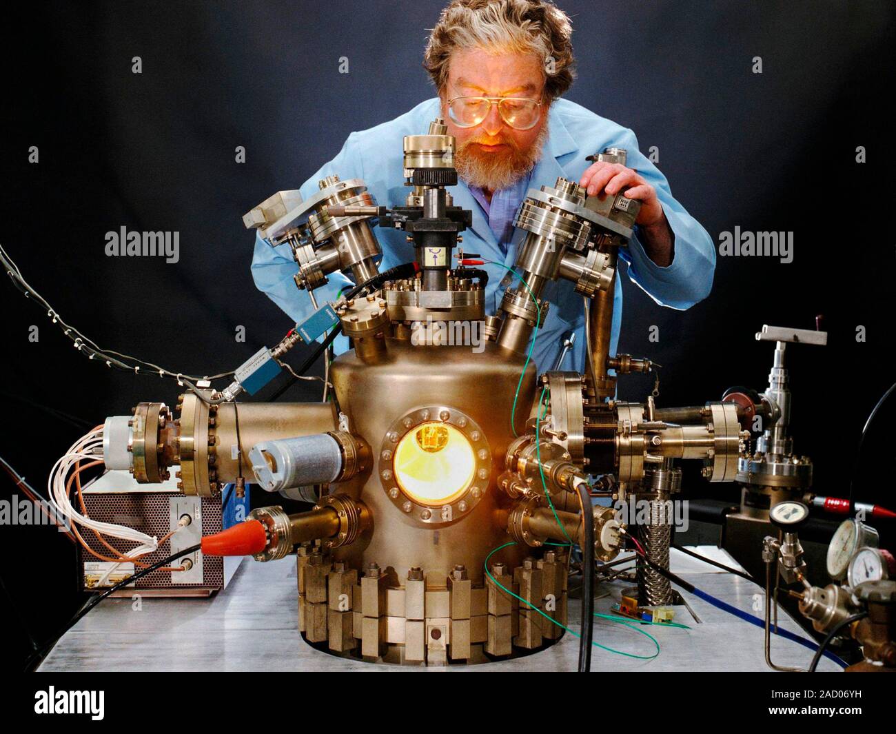 Surface analysis research. Researcher examining the Surface Analysis ...