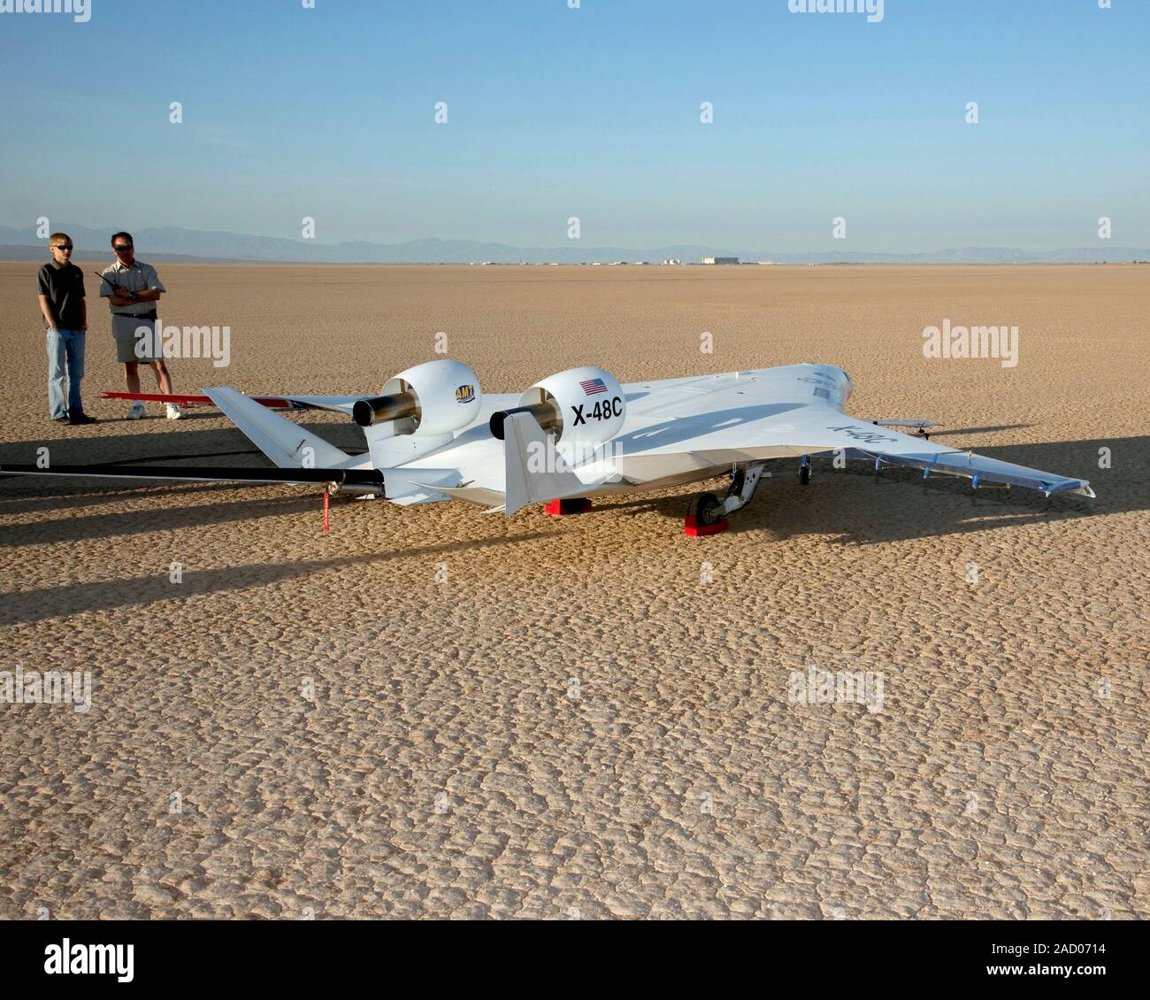 X-48C blended wing body aircraft. Researcher with sub-scale model of ...