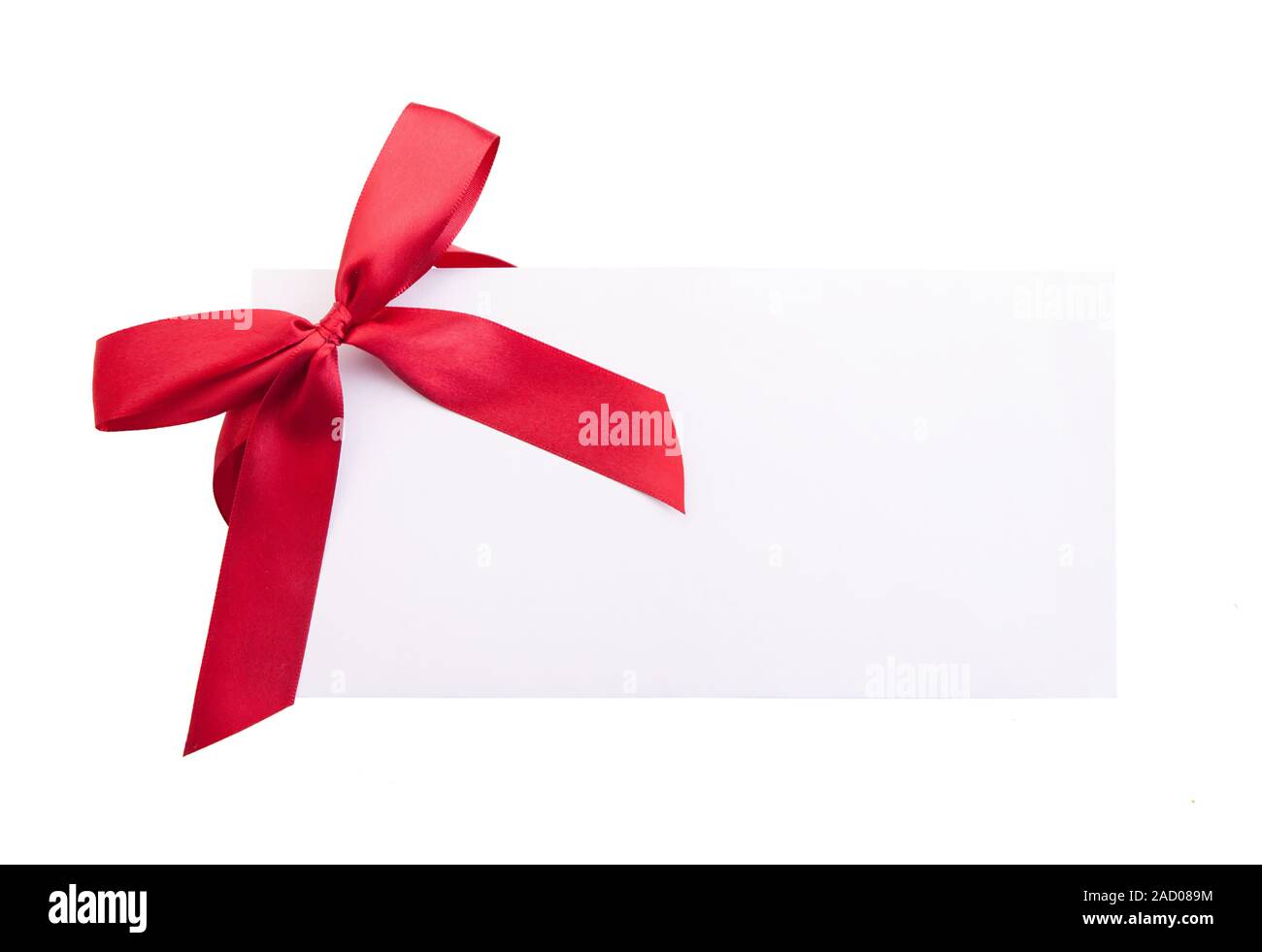 Card note with red ribbon on white background Stock Photo - Alamy
