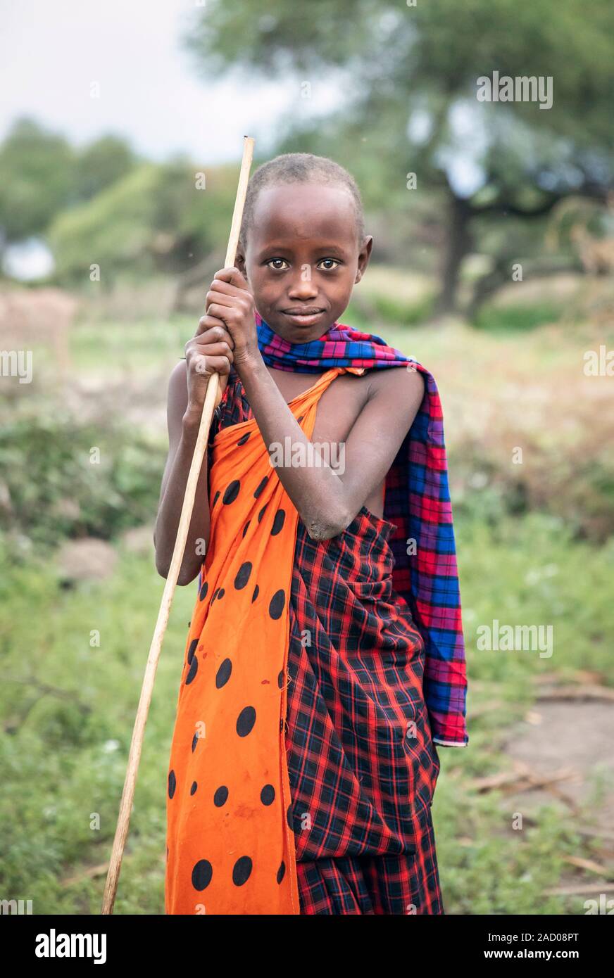 Same, Tanzania, 7th June 2019: maasai kid with a stick Stock Photo - Alamy
