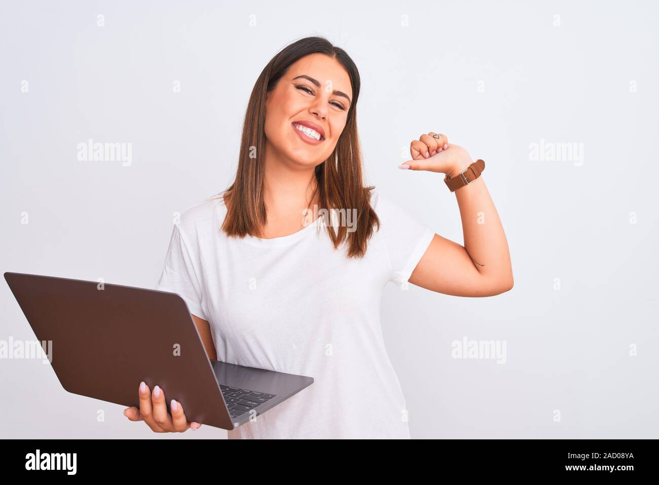 Beautiful young woman working using computer laptop over white ...