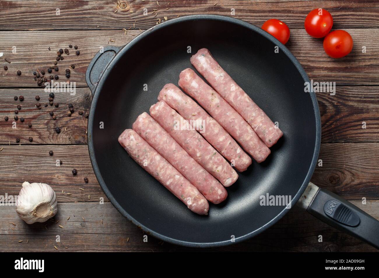 Raw Sausages in a Pan Stock Photo - Alamy