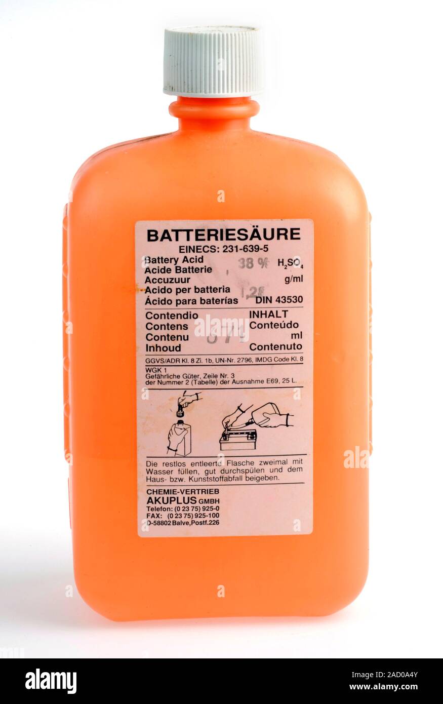 Vehicle battery acid. Bottle containing sulphuric acid (H2S04) for use ...