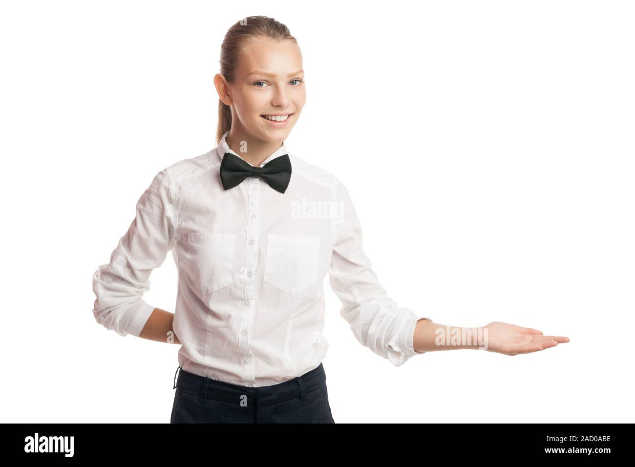 Portrait of young waitress offering something with arm Stock Photo - Alamy