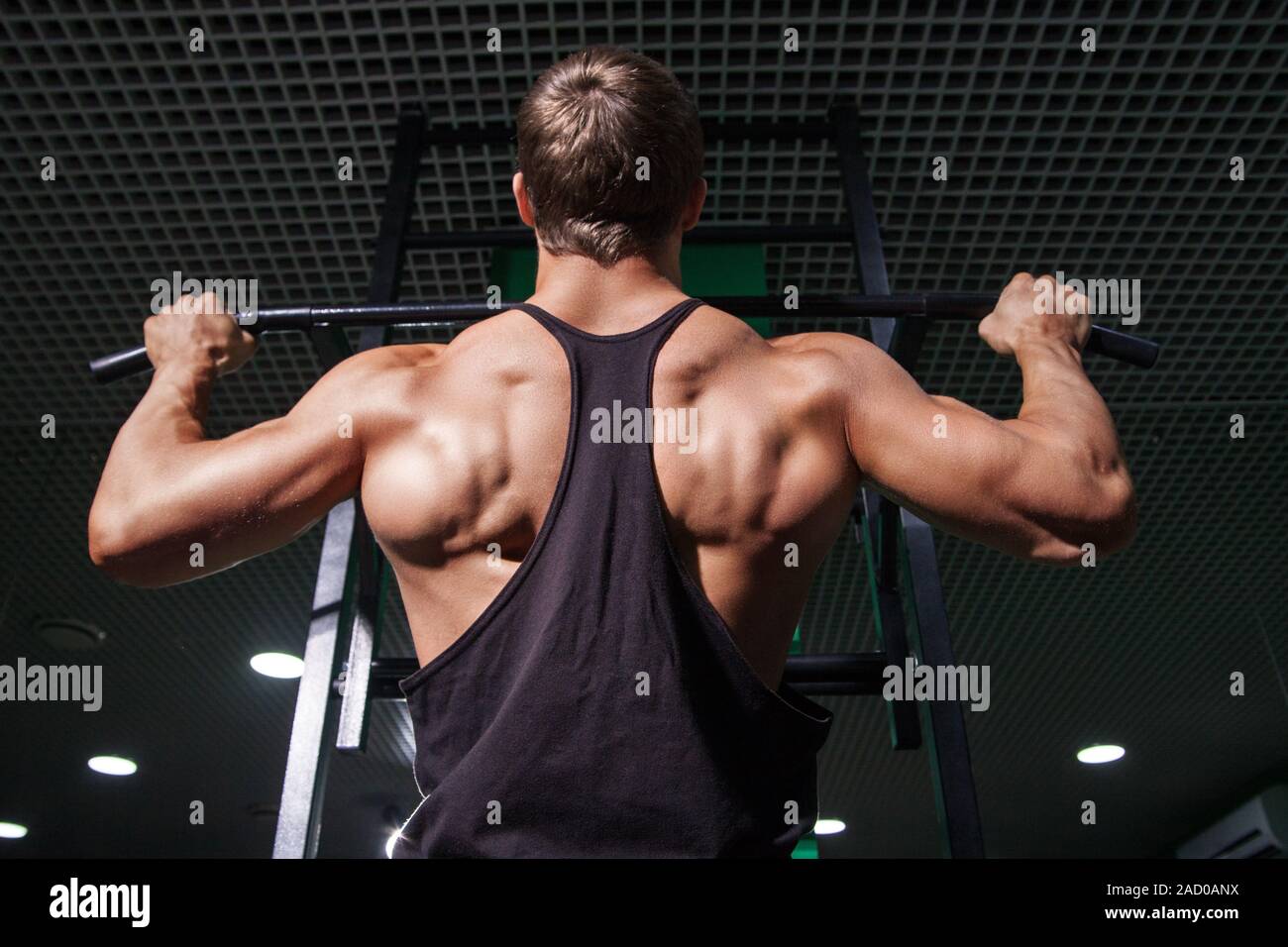 Strong muscular man doing pull ups on bar Stock Photo - Alamy