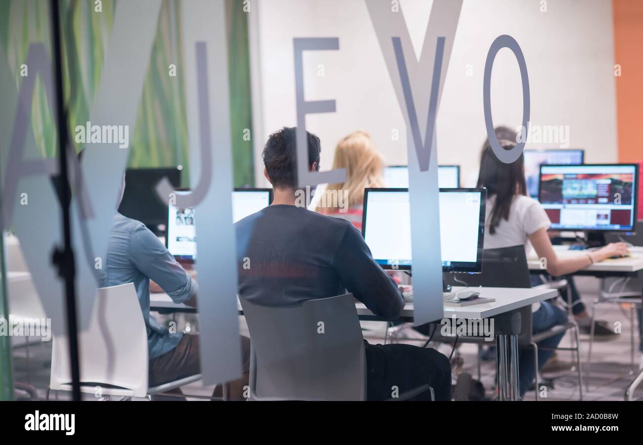 technology students group working in computer lab school classroom ...