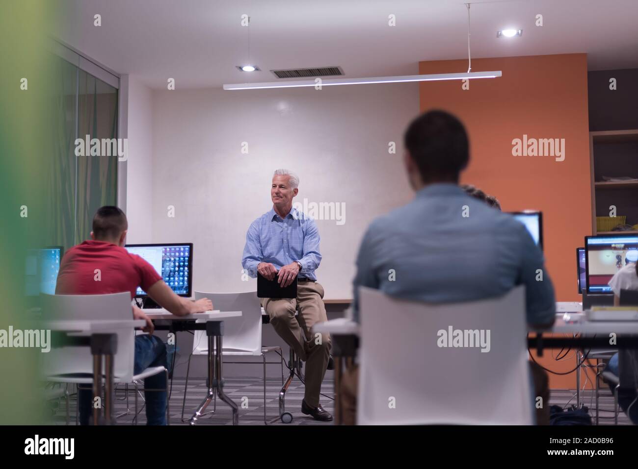 teacher and students in computer lab classroom Stock Photo - Alamy