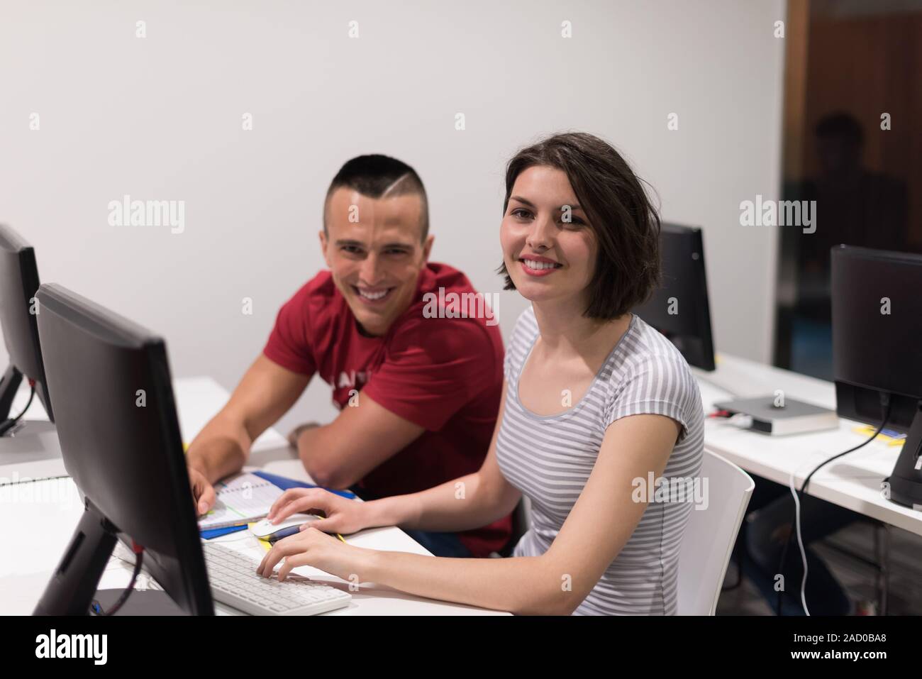 technology students group working in computer lab school classroom ...