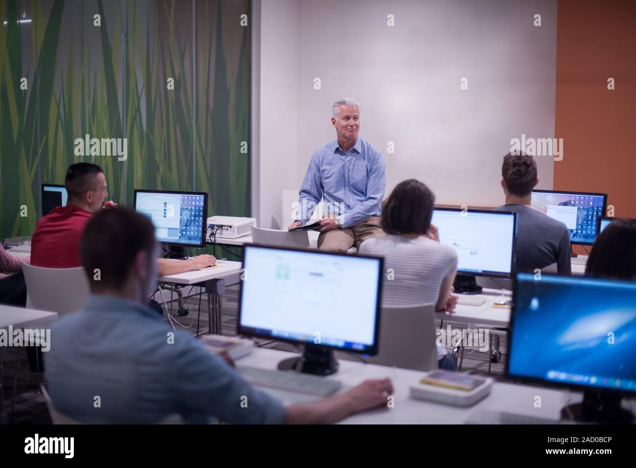 teacher and students in computer lab classroom Stock Photo - Alamy