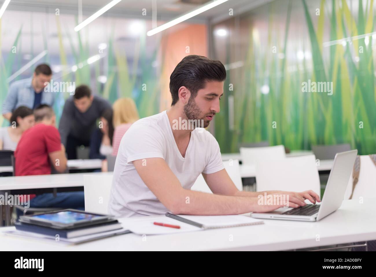 male student in classroom Stock Photo - Alamy