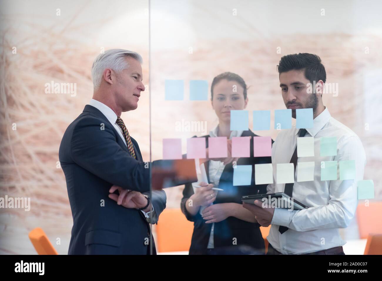 young creative Business people with senior ceo Stock Photo - Alamy