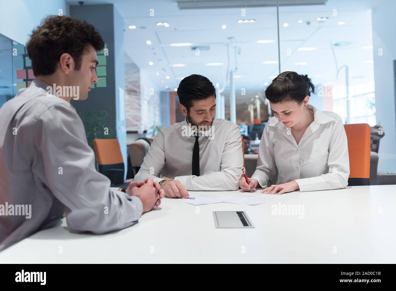 young couple signing contract documents on partners back Stock Photo ...