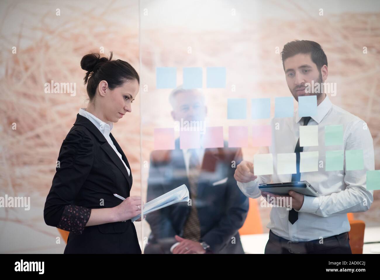 young creative Business people with senior ceo Stock Photo - Alamy
