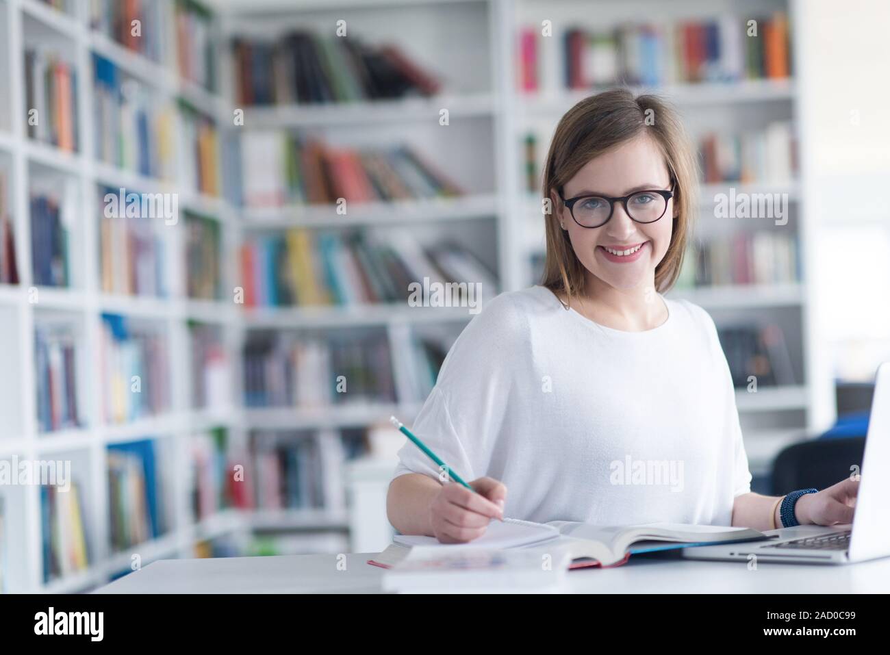 student study in library Stock Photo - Alamy