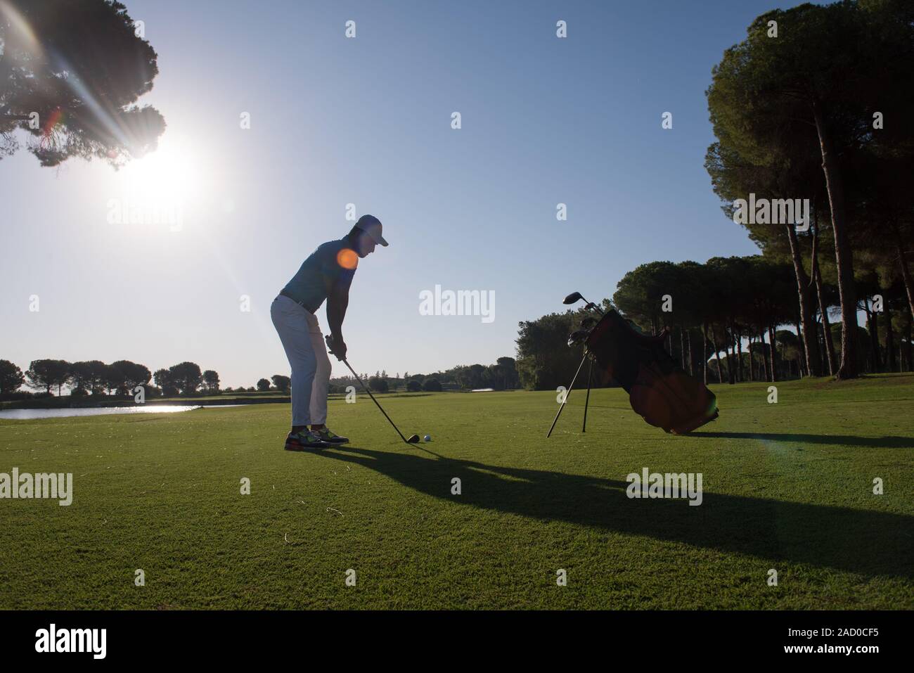 golf player hitting shot Stock Photo - Alamy