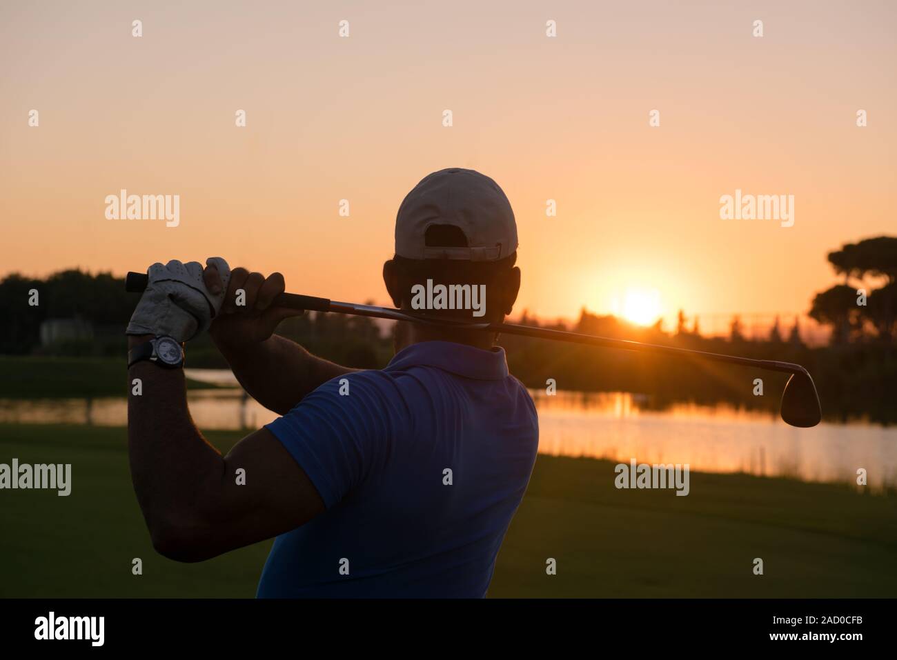 golfer hitting long shot Stock Photo - Alamy