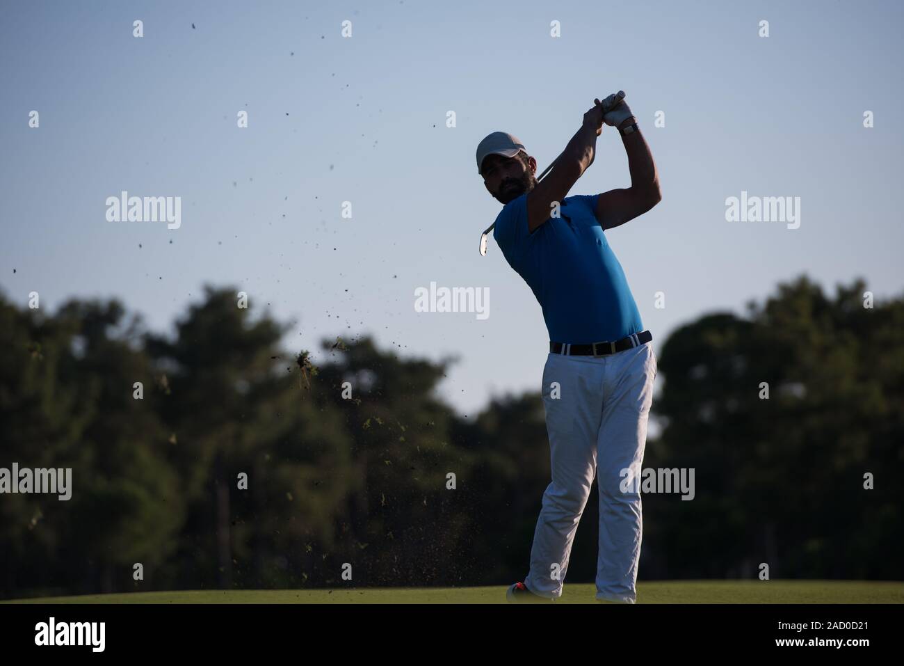golfer hitting long shot Stock Photo - Alamy