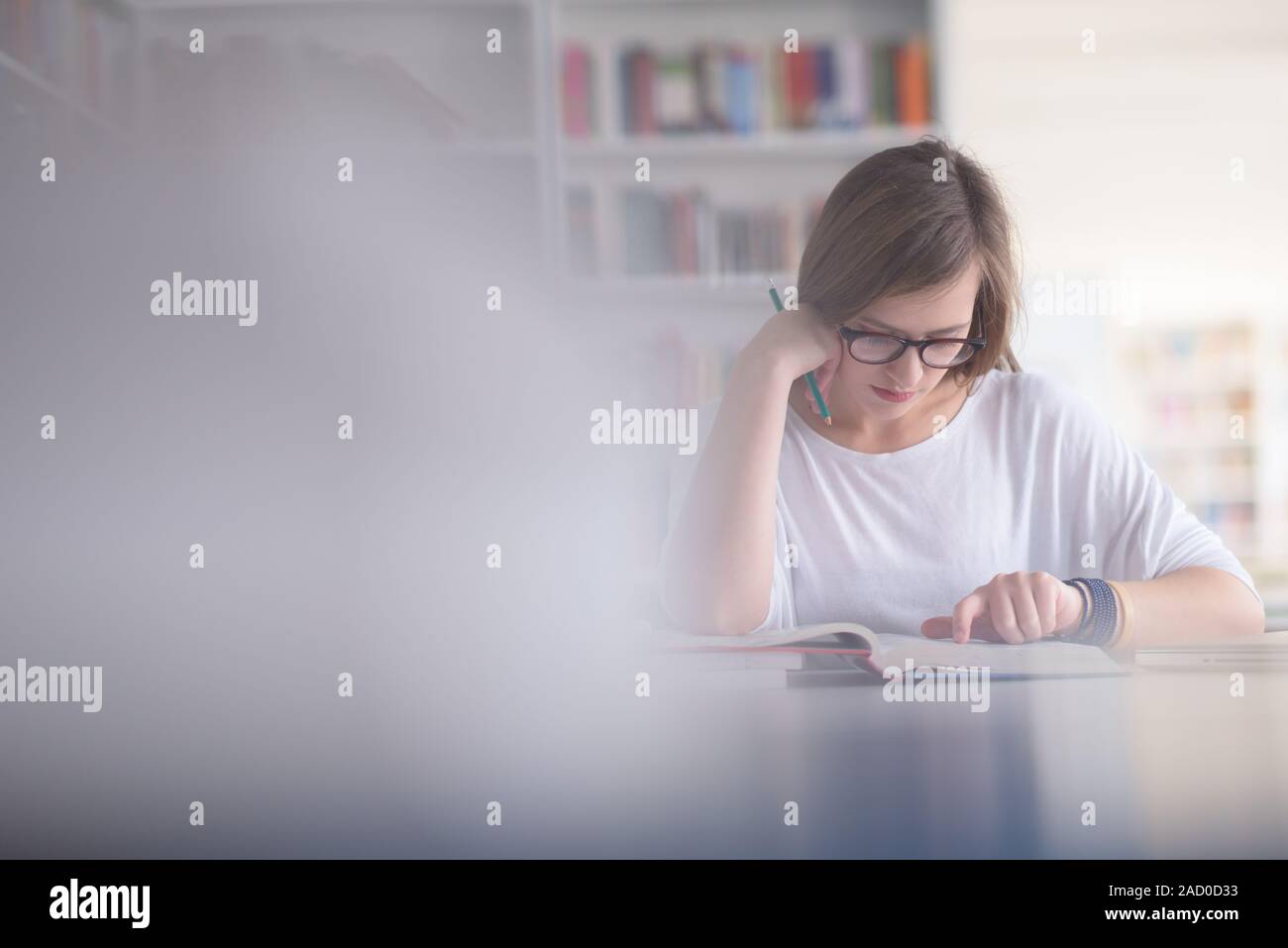 student study in library Stock Photo - Alamy