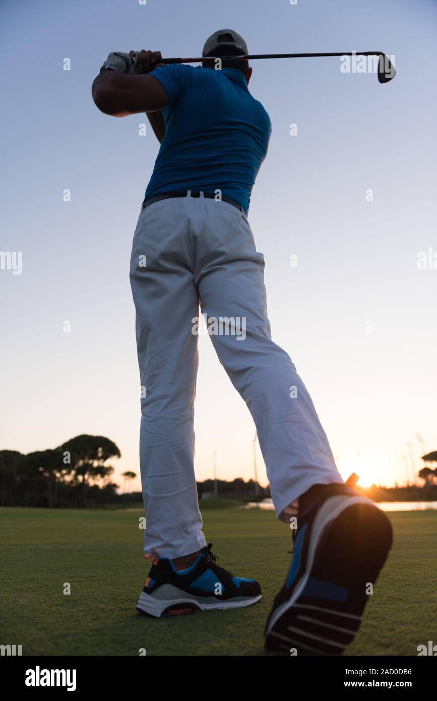 golfer hitting long shot Stock Photo - Alamy