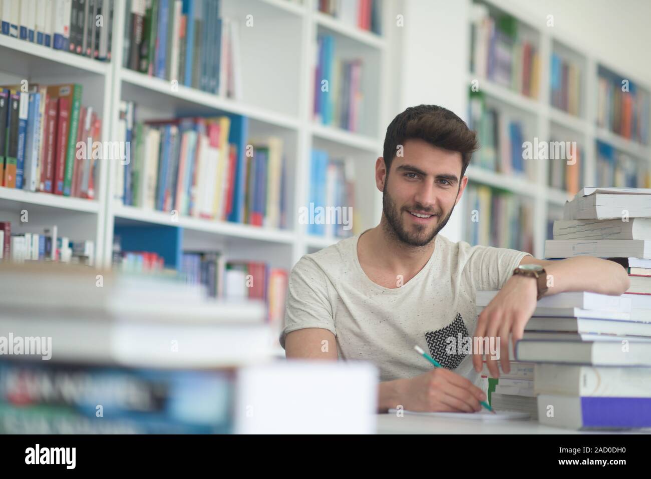 student study in school library Stock Photo - Alamy