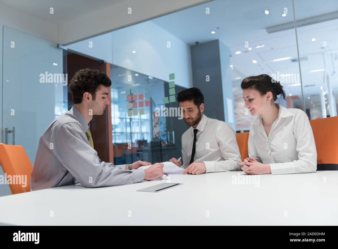 Signing contract on partners back hi-res stock photography and images ...