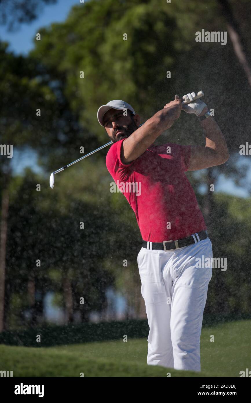 golfer hitting a sand bunker shot Stock Photo - Alamy