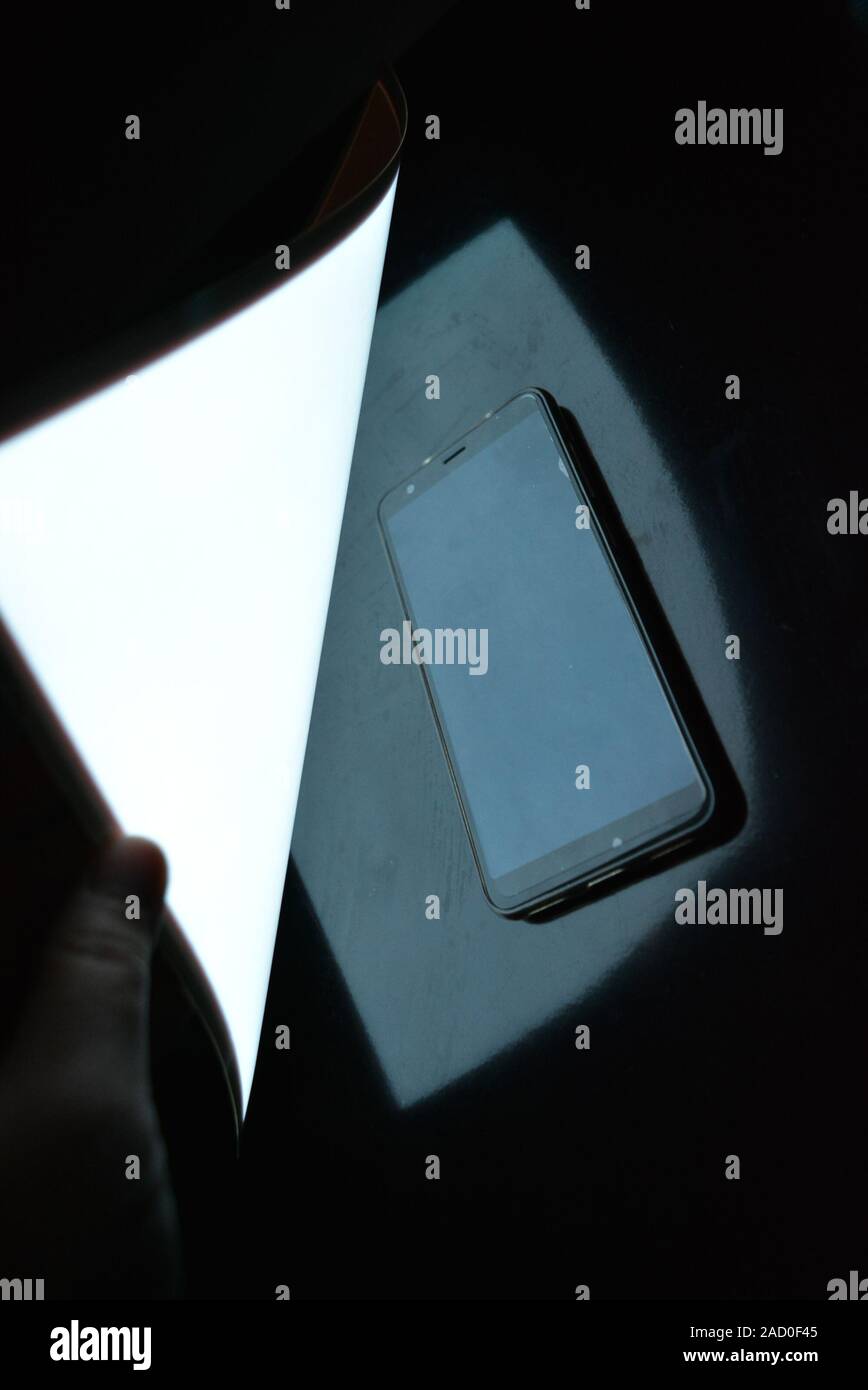 Very bright and luminous A4 paper with an electroluminescent coating ...