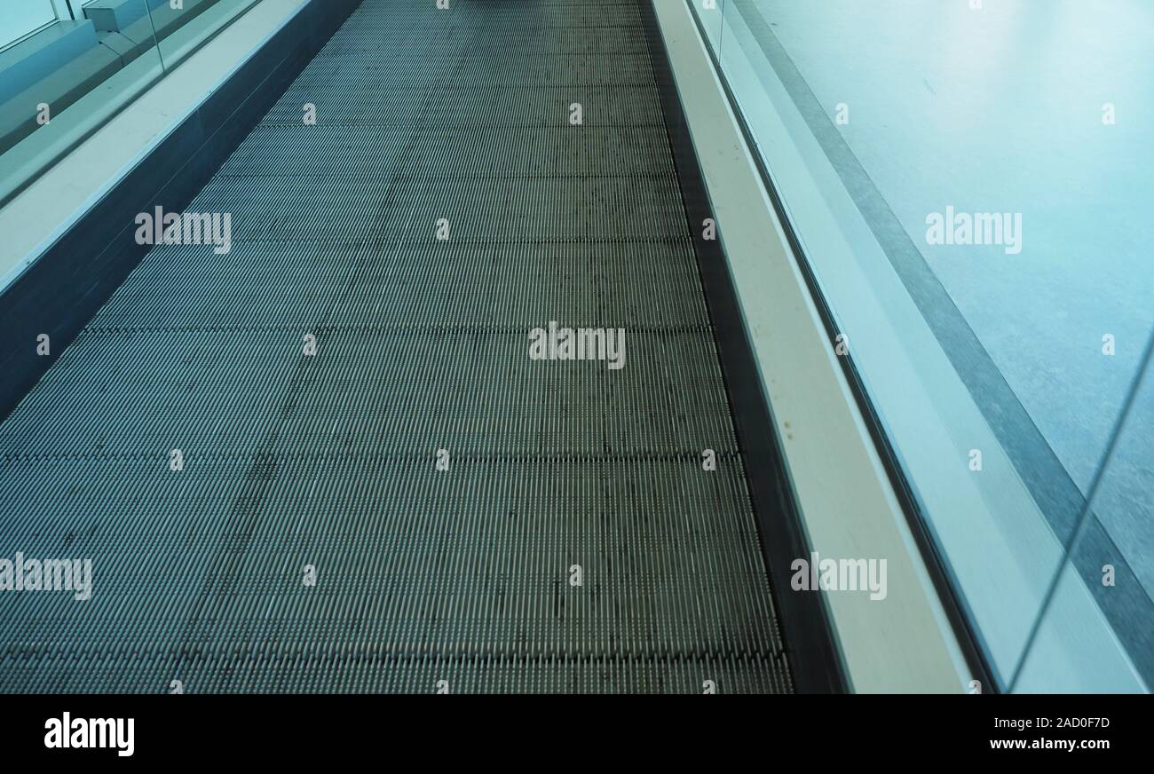 walkalator (aka moving walkway) tape in an airport Stock Photo - Alamy