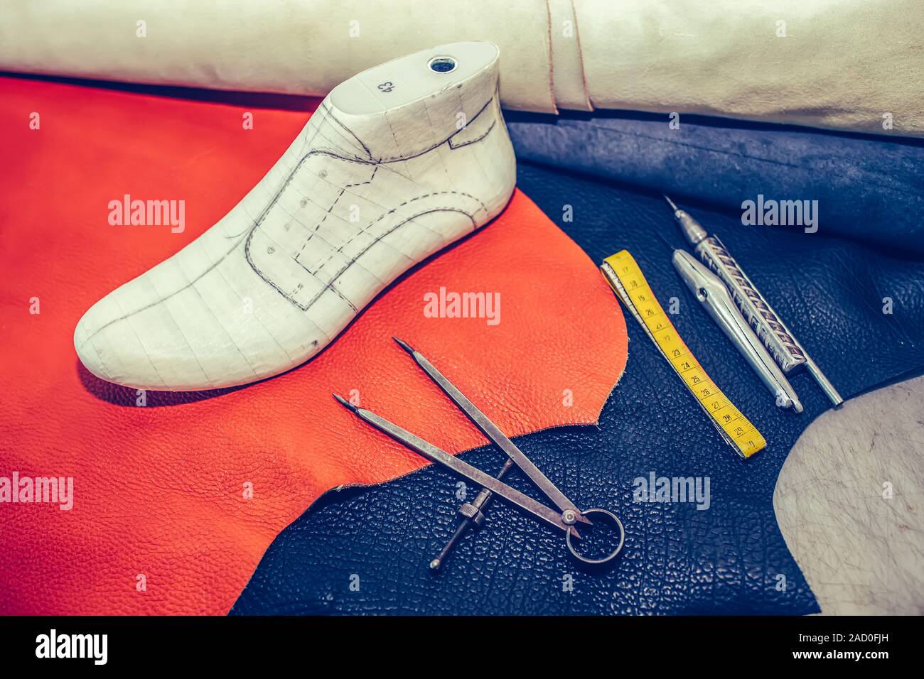Leather craft tools on wooden background. Workplace for shoemaker. Cobbler workplace with tools ...