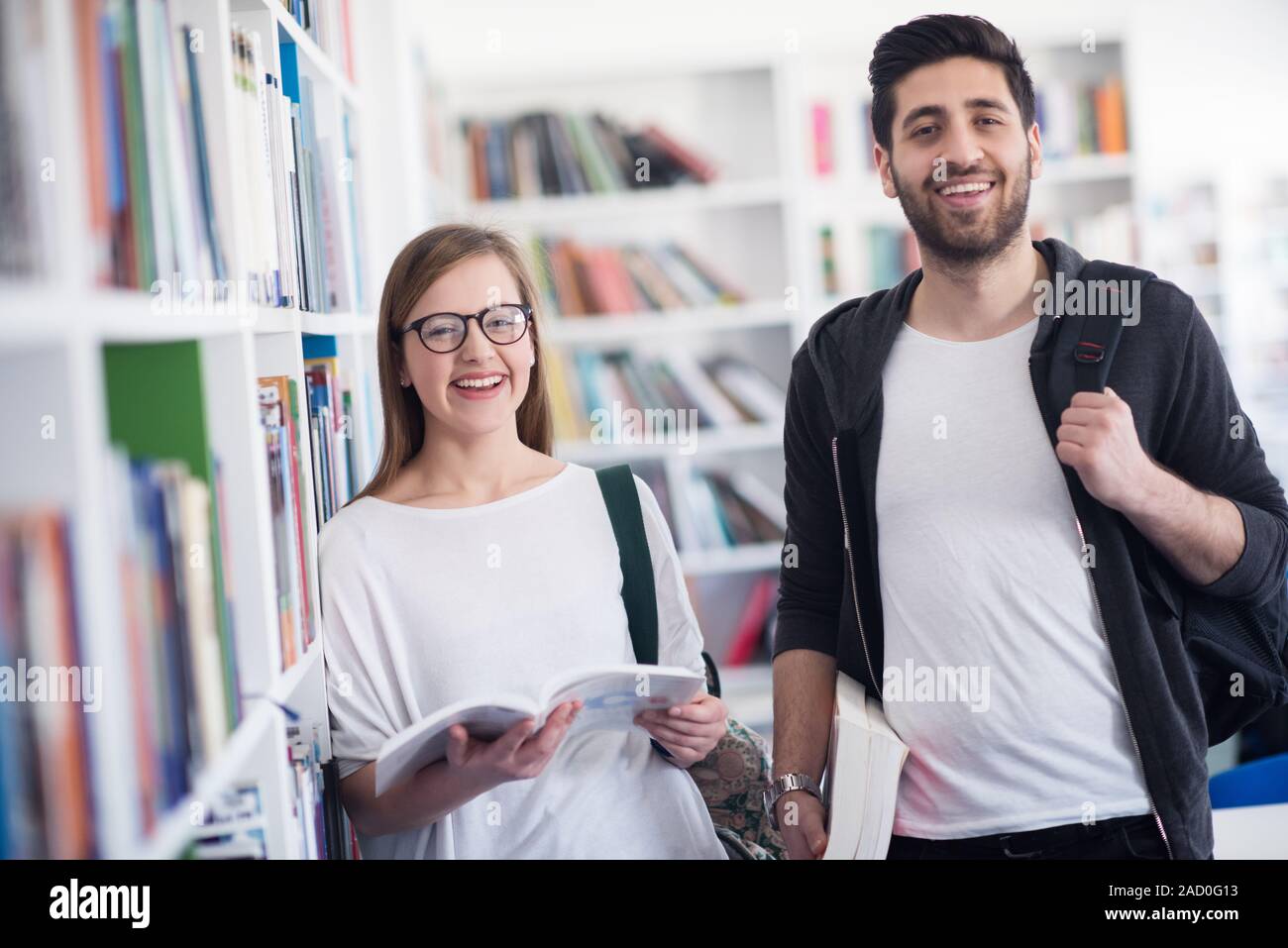 students couple in school library Stock Photo - Alamy