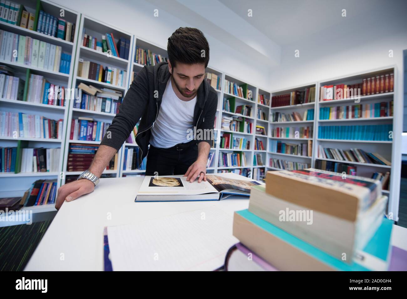 student study in school library Stock Photo - Alamy