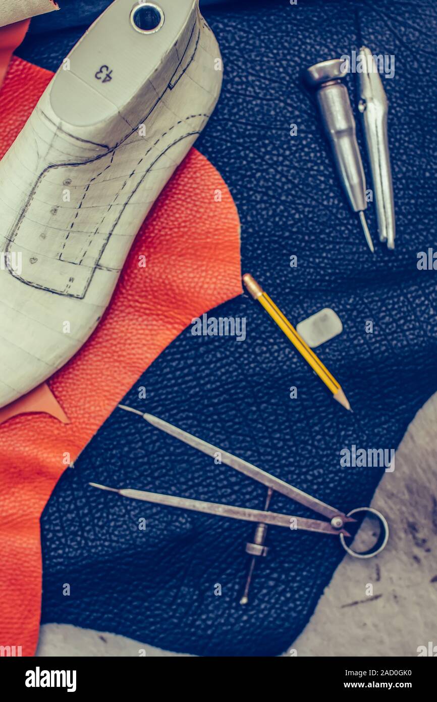 Shoemaker's work desk. Tools and leather at cobbler workplace. Shoes ...
